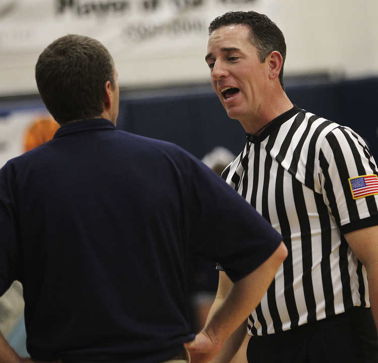 InFini Robinson leads referee crew during high school basketball game ...