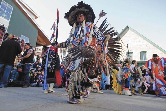 A member of the Native American Northern Ute Tribe dances on Jan. 14 ...