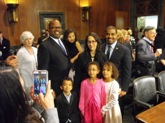 Las Vegas federal public defender Richard Boulware holds his daughter ...