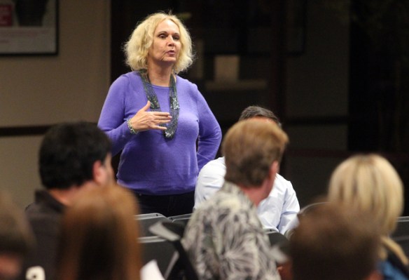 Davida Rochelle asks a question during a panel discussion about medical ...