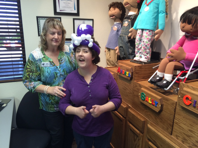 Robin Kincaid and her daughter, Kayla, pause April 13 during an open ...