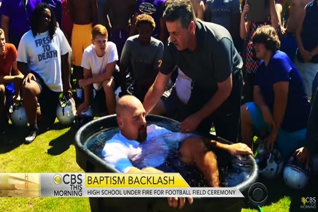 High school football coach holds mass-baptism on school’s field — VIDEO ...