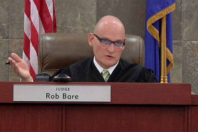 New judge to decide sentence for man jailed while lawyer was handcuffed ...