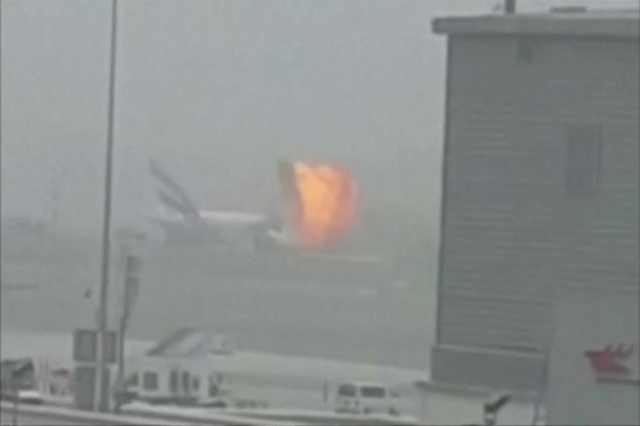 Passengers, crew survive fiery crash at Dubai airport; firefighter ...