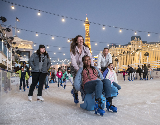 The Cosmopolitan’s rooftop ice rink invites visitors to take a spin ...