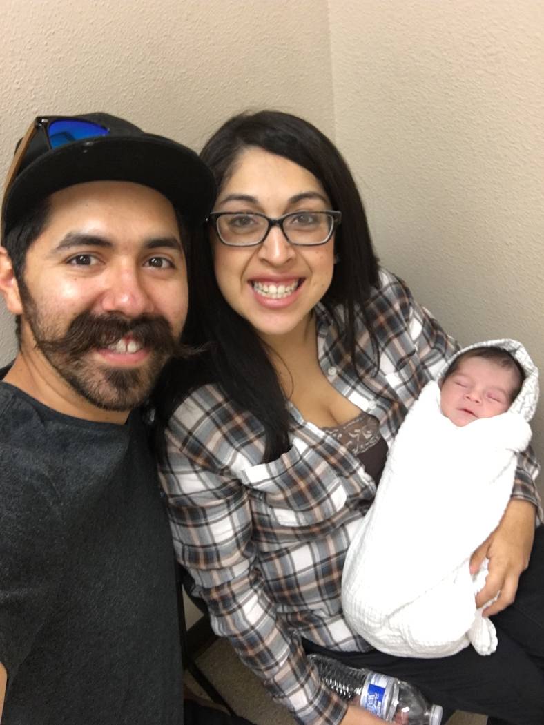Mikey and Vanessa Esquivel of San Jacinto, California, pose with their ...