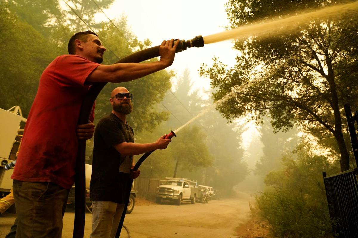 Neighbors target California wildfires as crews tell them to stop ...