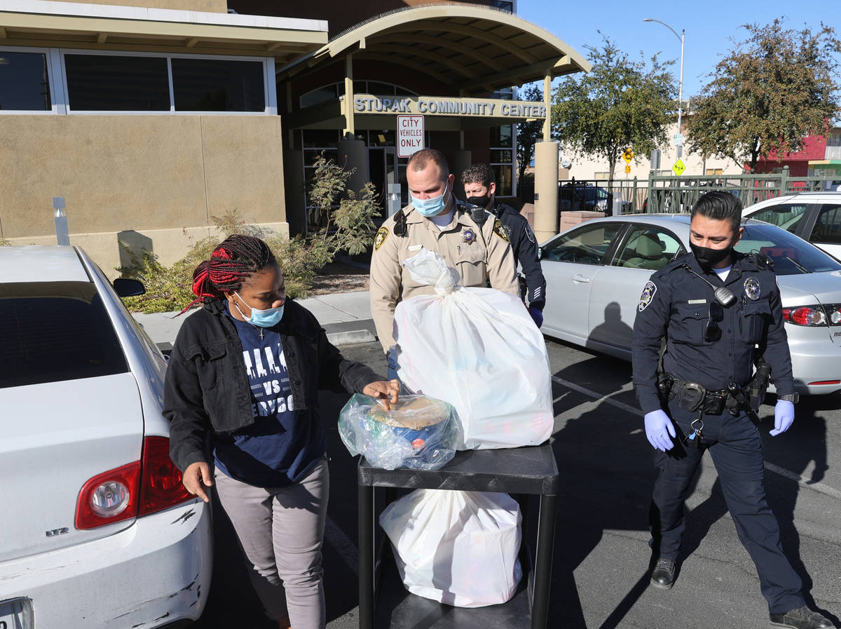 Stupak center offers cheer to Las Vegas families by giving holiday bags ...