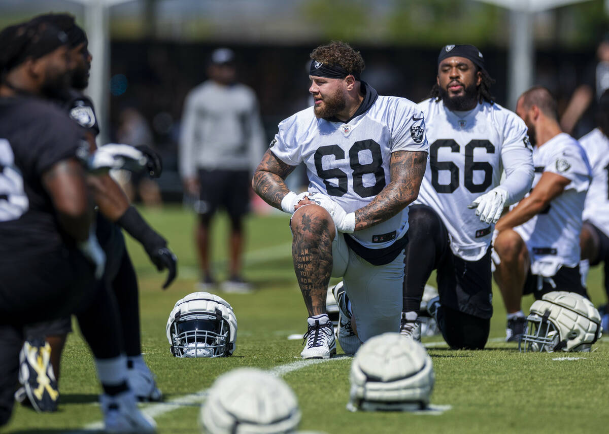 Raiders offensive line holds its own against defense with pads on ...