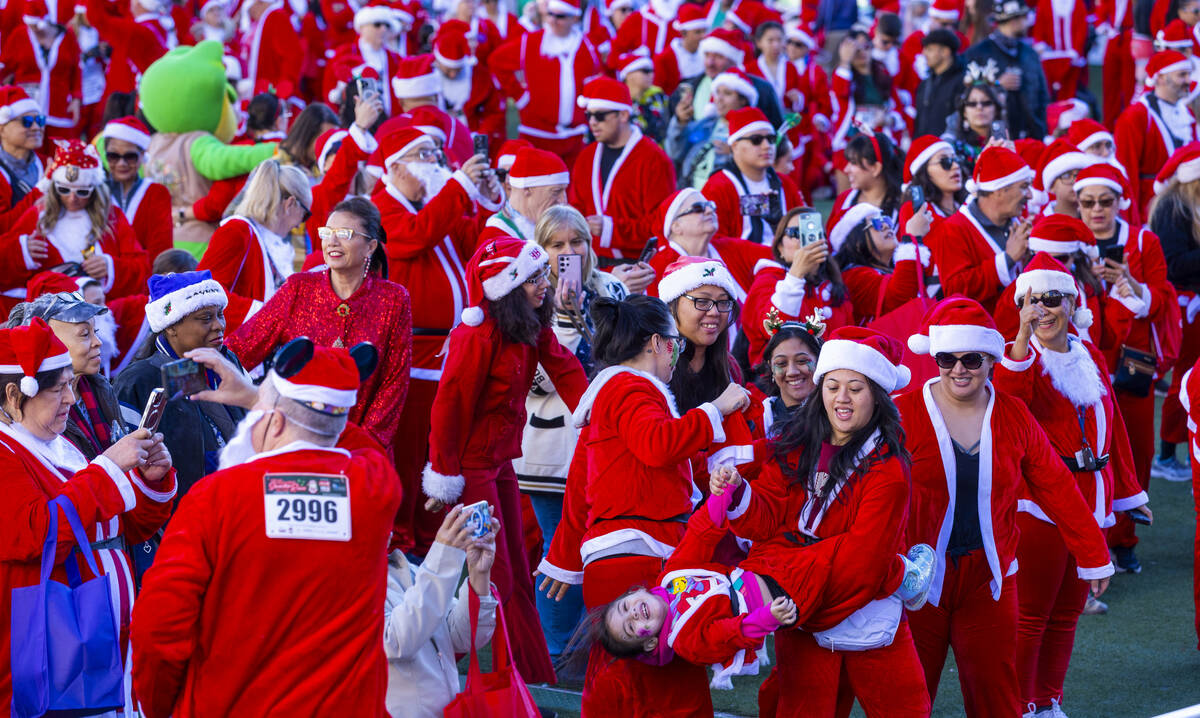 Thousands of Santas run in downtown Las Vegas to raise money for Opportunity Village | Downtown ...