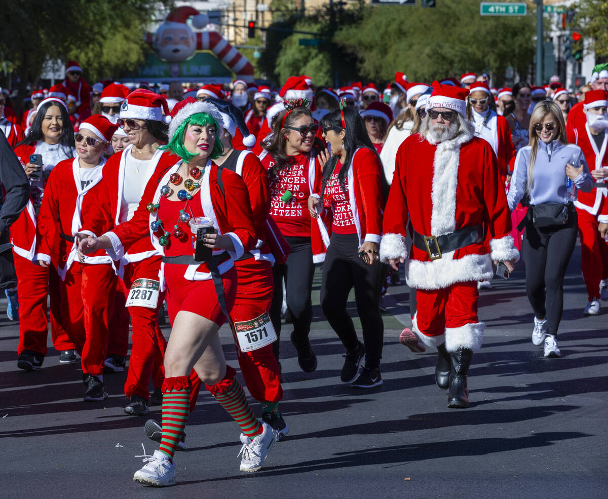 Thousands of Santas run in downtown Las Vegas to raise money for ...